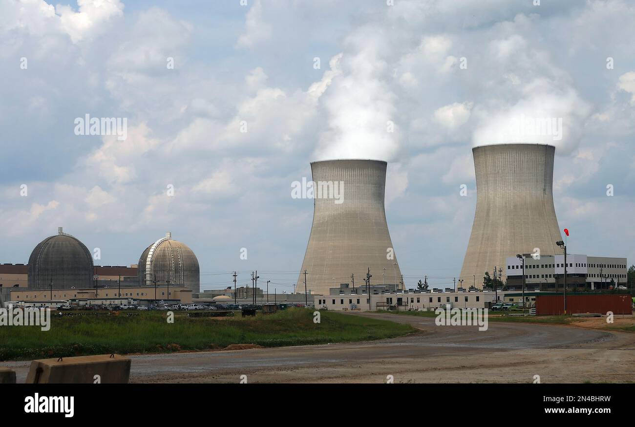 The cooling towers, right, and nuclear reactor containment buildings ...