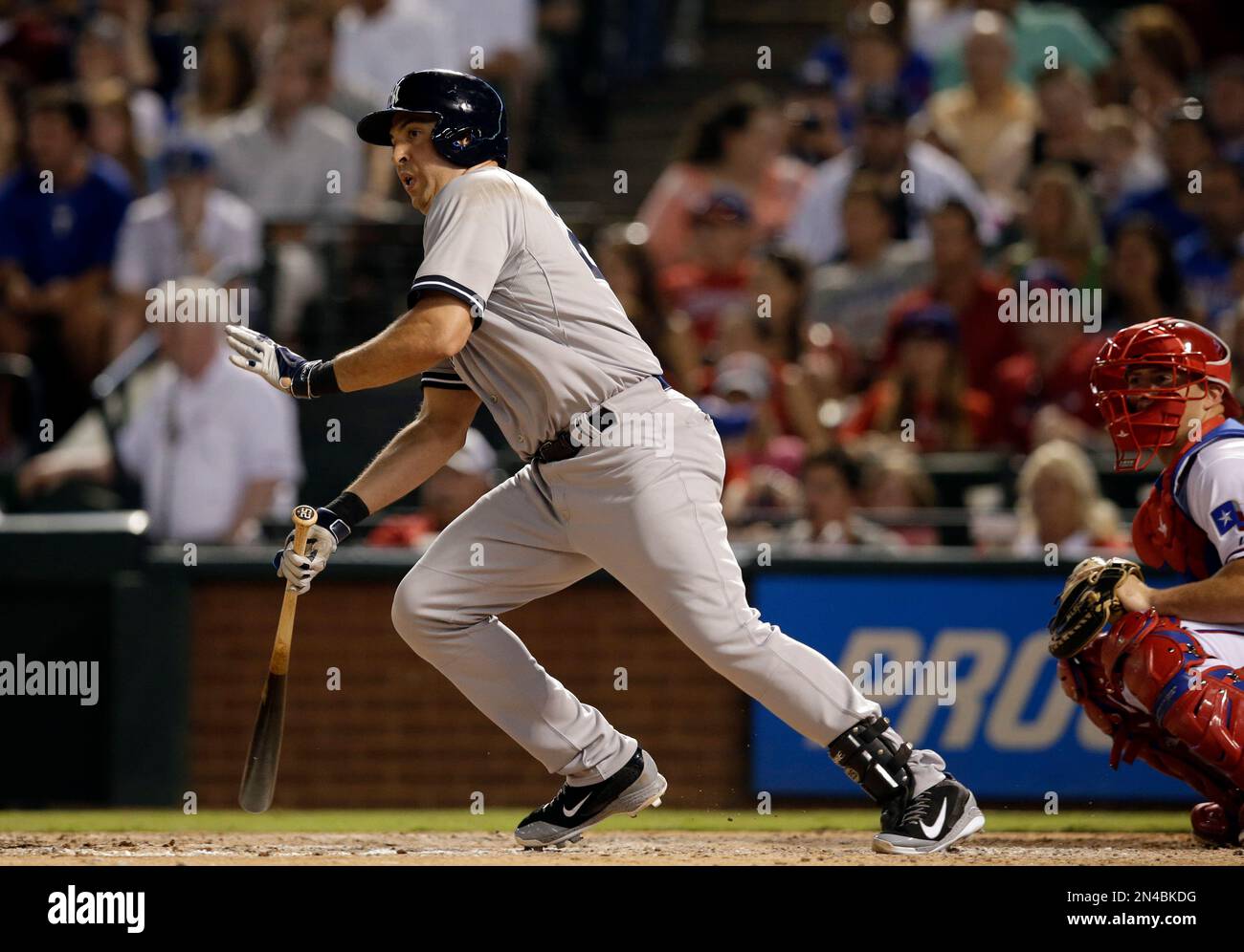 New York Yankees' Mark Teixeira follows through on a single to left off ...