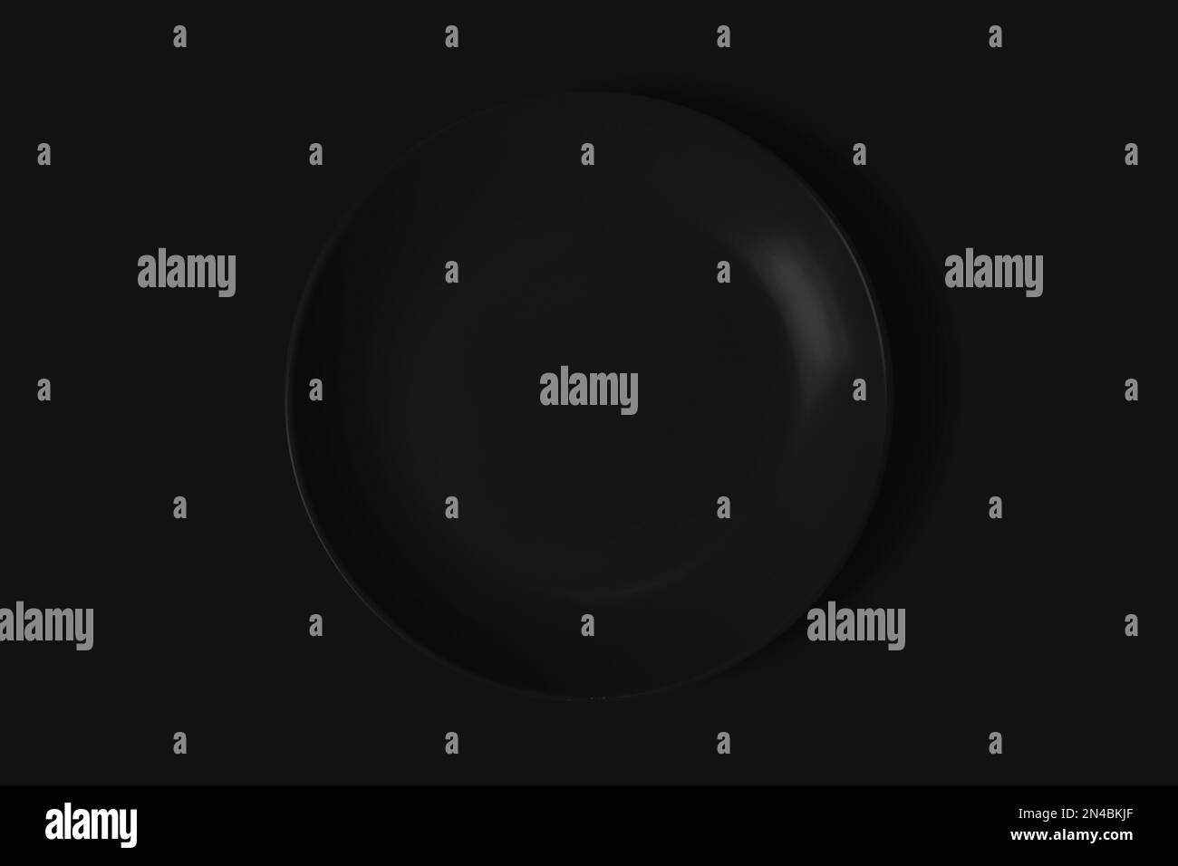 Black plate on a black background. View from above. Concept Stock Photo ...
