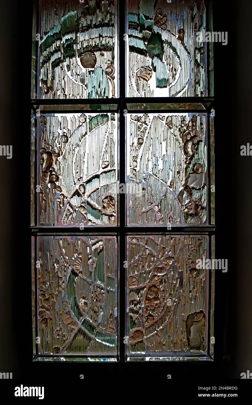 Colorful textures on the glass of a window highlighted from outside ...