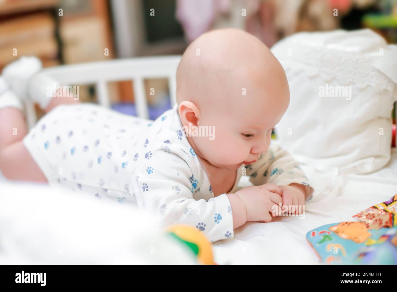 The tiny newborn saw his fingers. Development of fine motor skills of ...