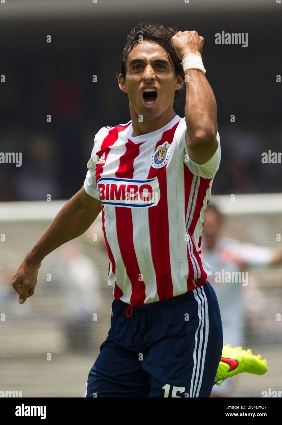 Chivas´ Fernando Arce celebrates after scoring against Pumas during a ...