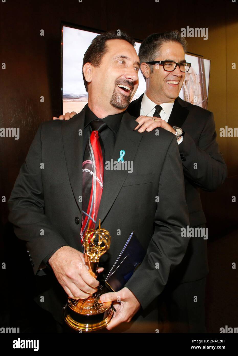 James Freeman, left, is seen backstage at the Television Academy's 66th ...