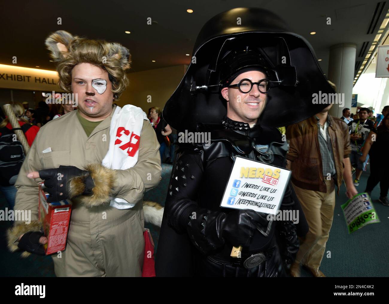 Costumed characters pose for photos on day 3 at the 2014 Comic-Con ...