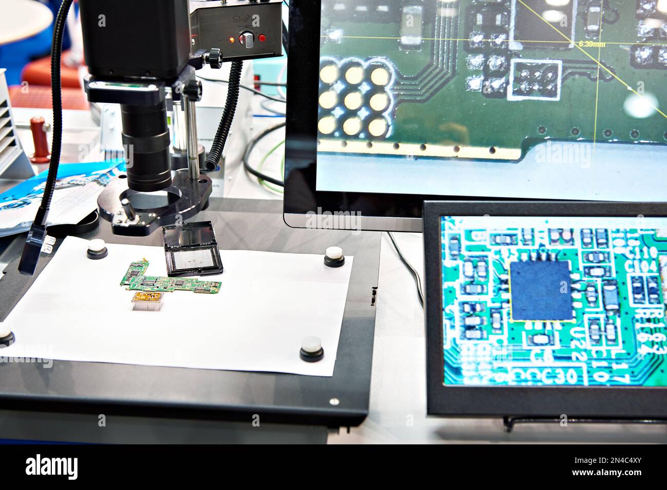Electronic boards and chips, industrial microscope and monitors Stock ...