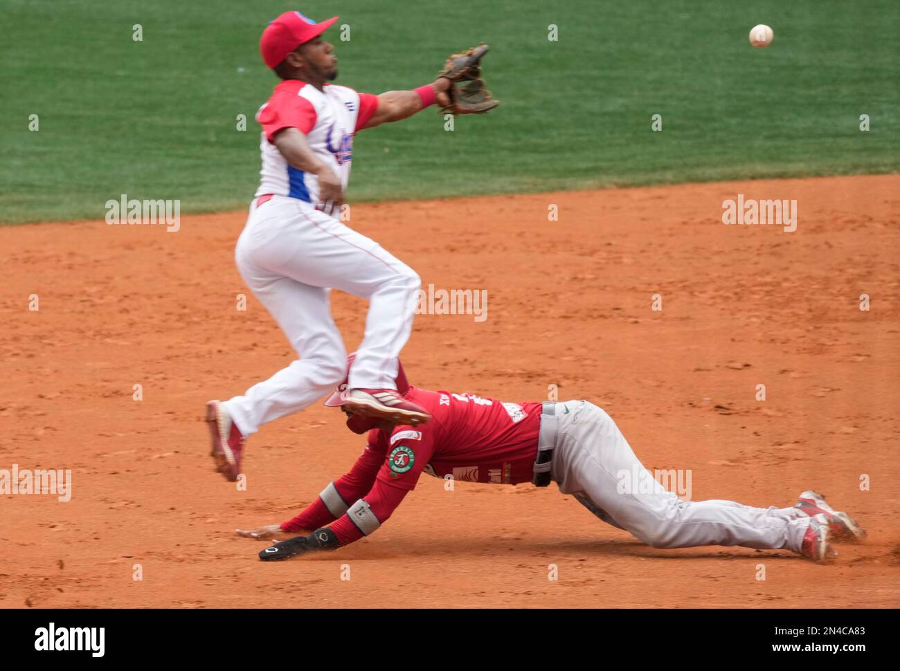 Panama's Johnny Santos safely steals to second as Cuba's Andres De La ...
