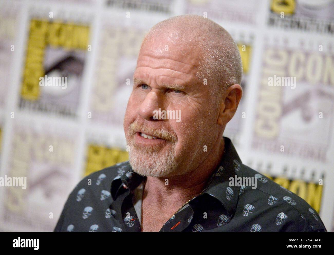 Ron Perlman attends the 20th Century Fox press line on Day 2 of Comic ...