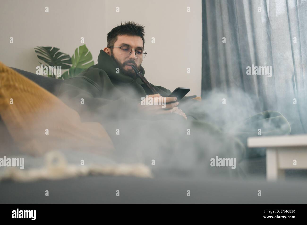 Arab man smoking shisha on hi-res stock photography and images - Alamy
