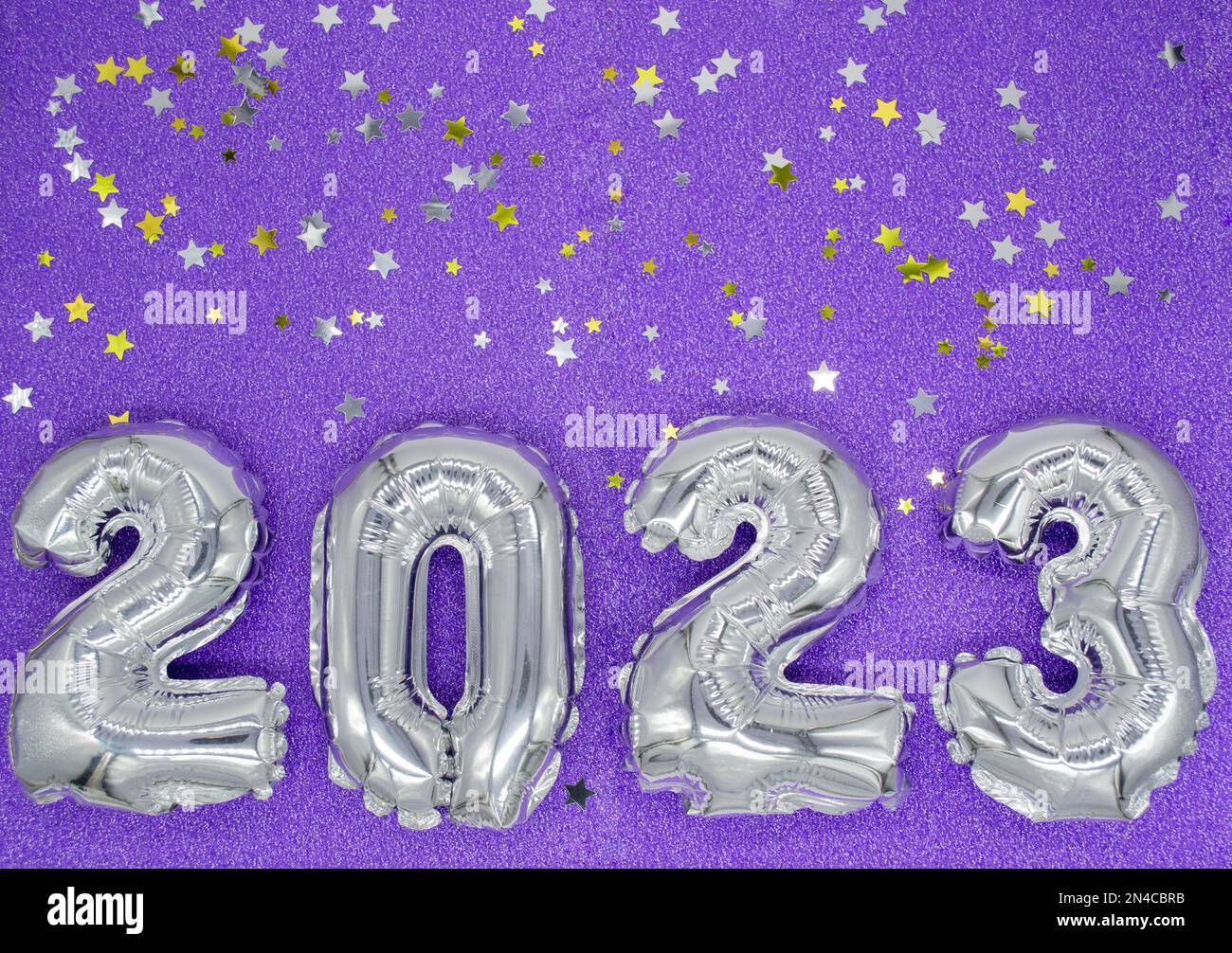 Inflatable shiny silver numbers of the New year 2023 on purple, very ...