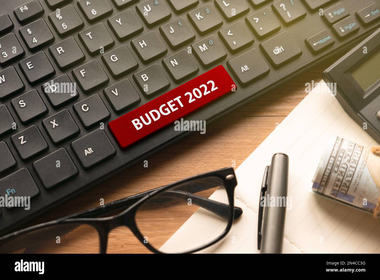 Glasses,pen,book,money, calculator and computer keyboard written with ...