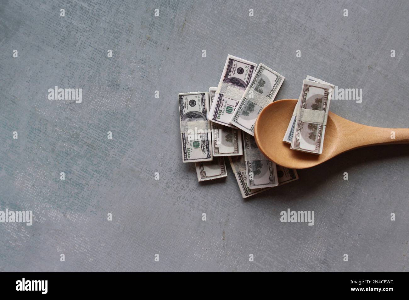 Spoon and money. Gain profit, revenue collection, income and earning ...