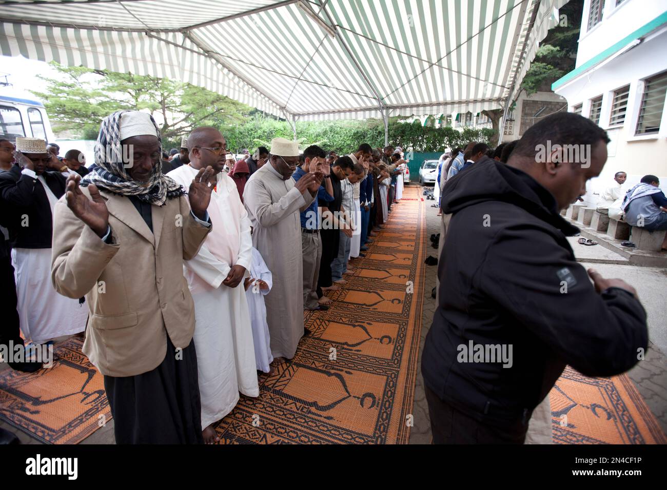 Kenyan Muslims stand for prayers at the Noor Masjid on the last Friday ...