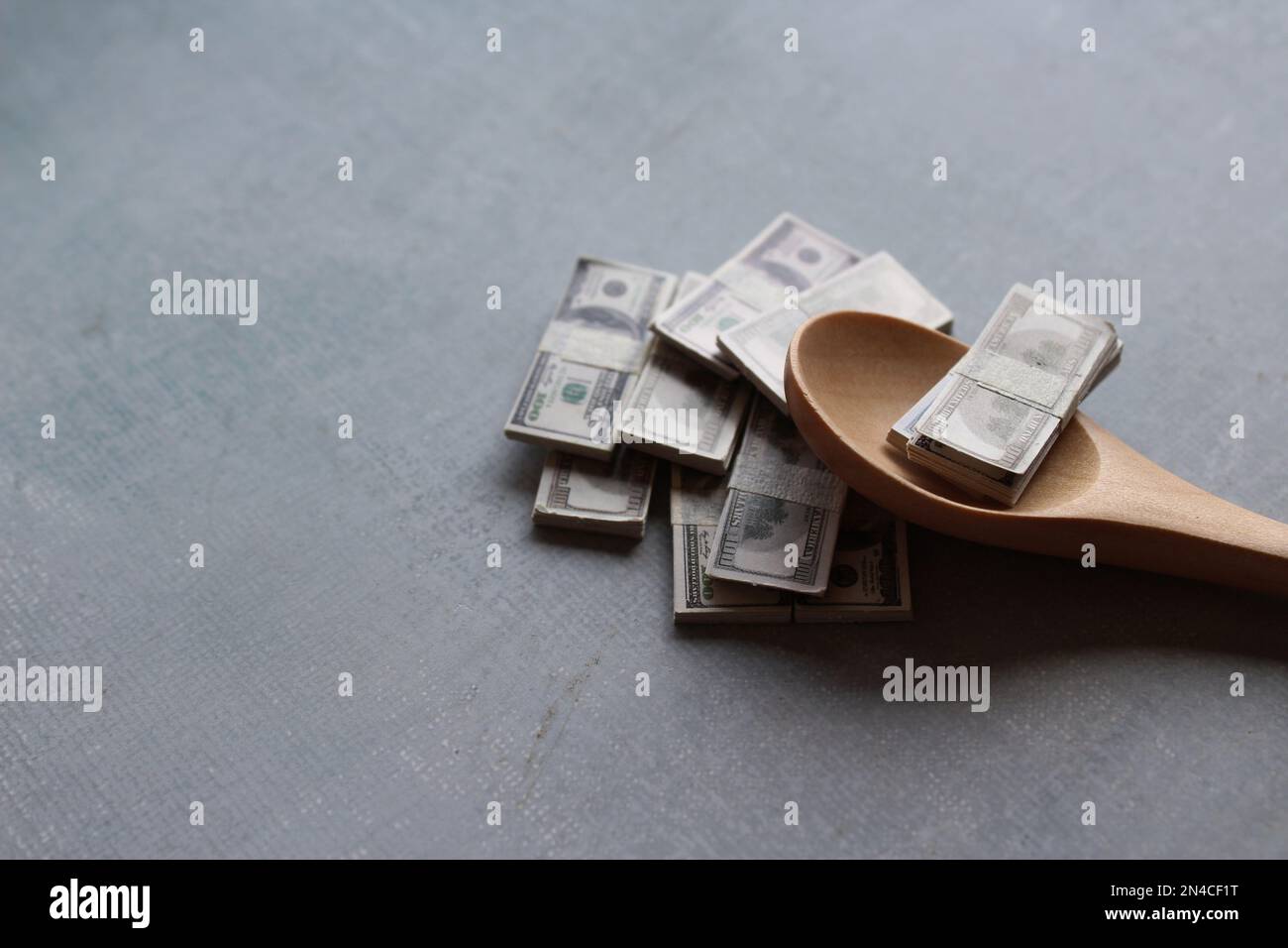 Spoon and money. Gain profit, revenue collection, income and earning ...