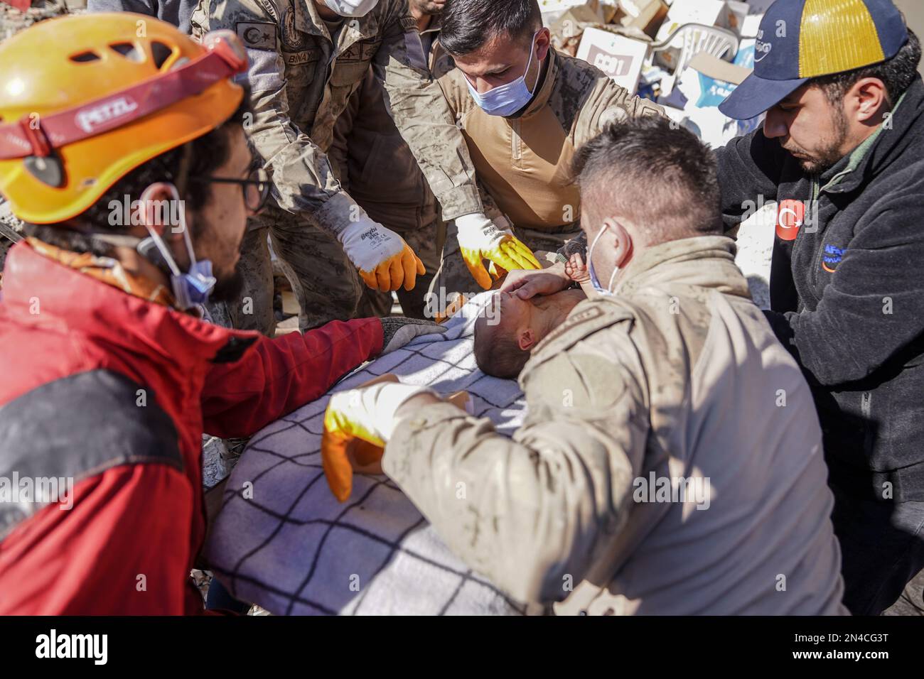 Hatay, Turkey. 08th Feb, 2023. Soldiers examine a 20-day-old baby who ...