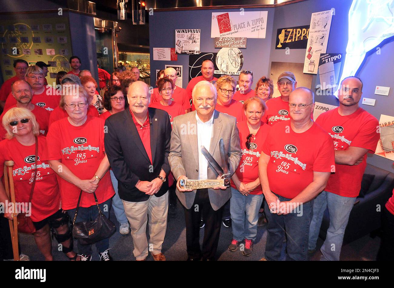 Surrounded by 25 year employees Zippo/W.R. Case & Sons Cutlery Co. owner George Duke and ...