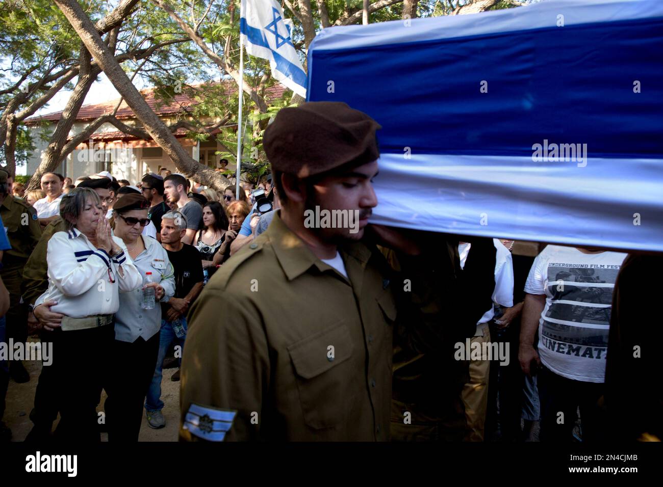 Israeli soldiers carry the coffin of Staff Sgt. Daniel Pomerantz during ...