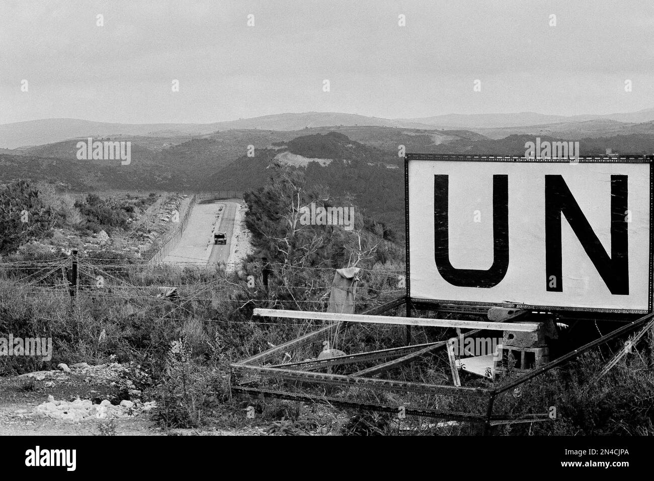 A U.N. observation post overlooks fortified Israeli border at left ...