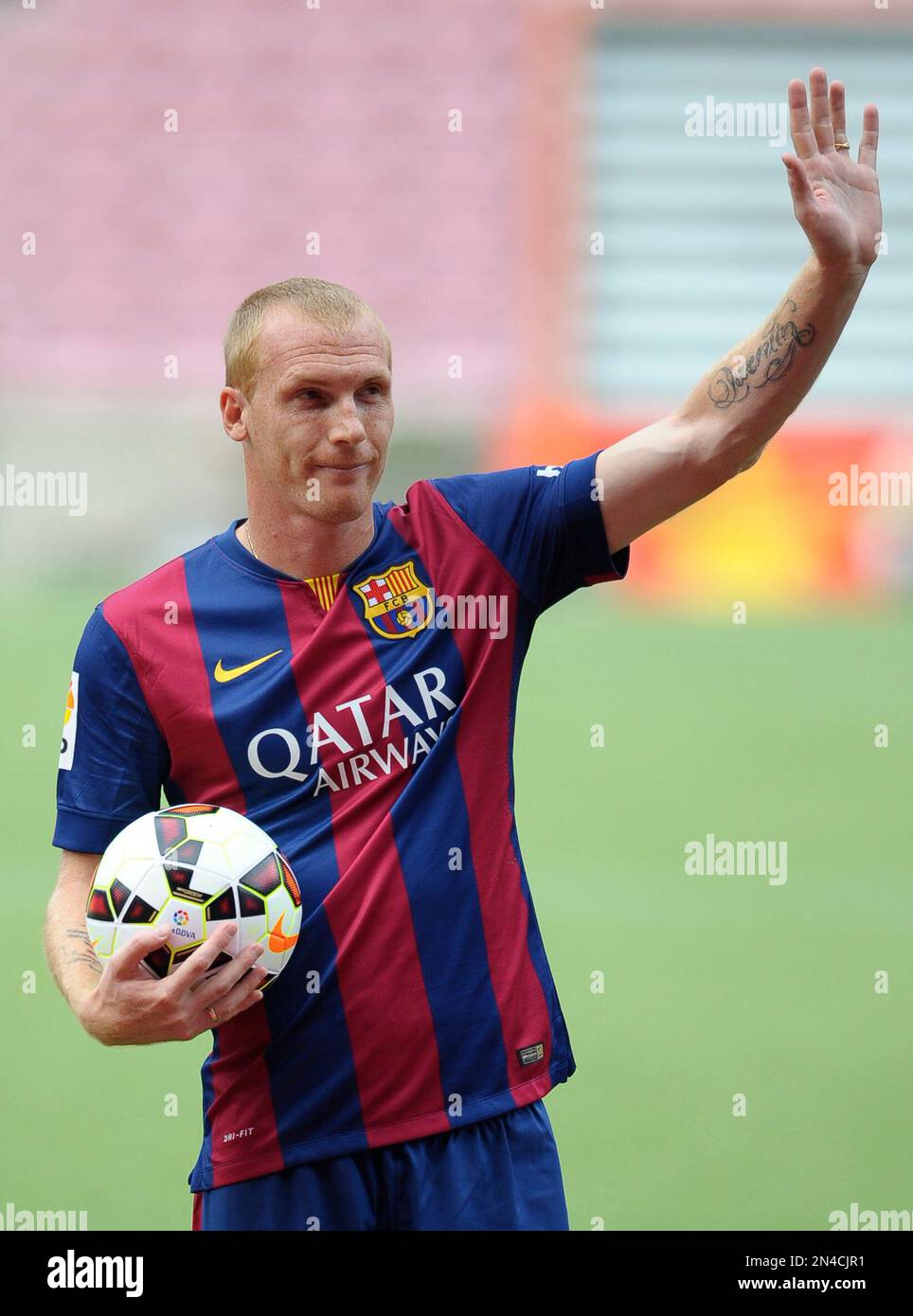 FC Barcelona's new French player Jeremy Mathieu waves during his ...