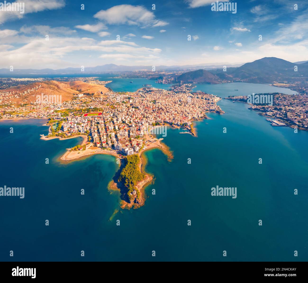 Sunny view from flying drone of Chalcis town. Adorable morning seascape ...