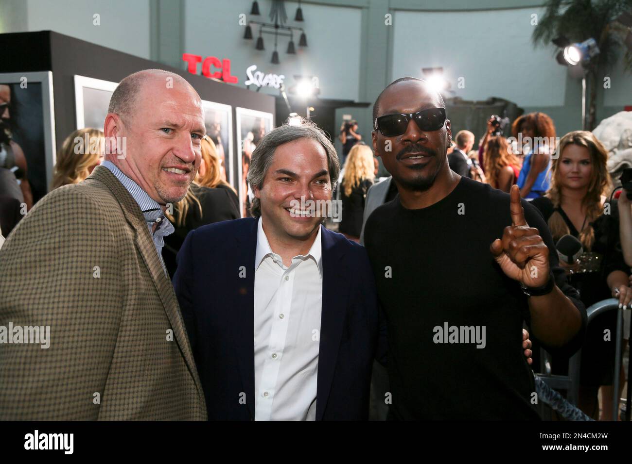 From left, Paramount's Rob Moore and Adam Goodman pose with actor Eddie ...