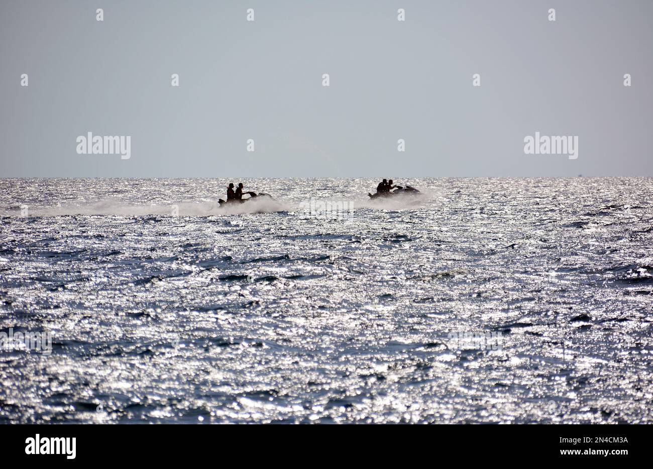 two jet skis speeding through the sea Stock Photo - Alamy