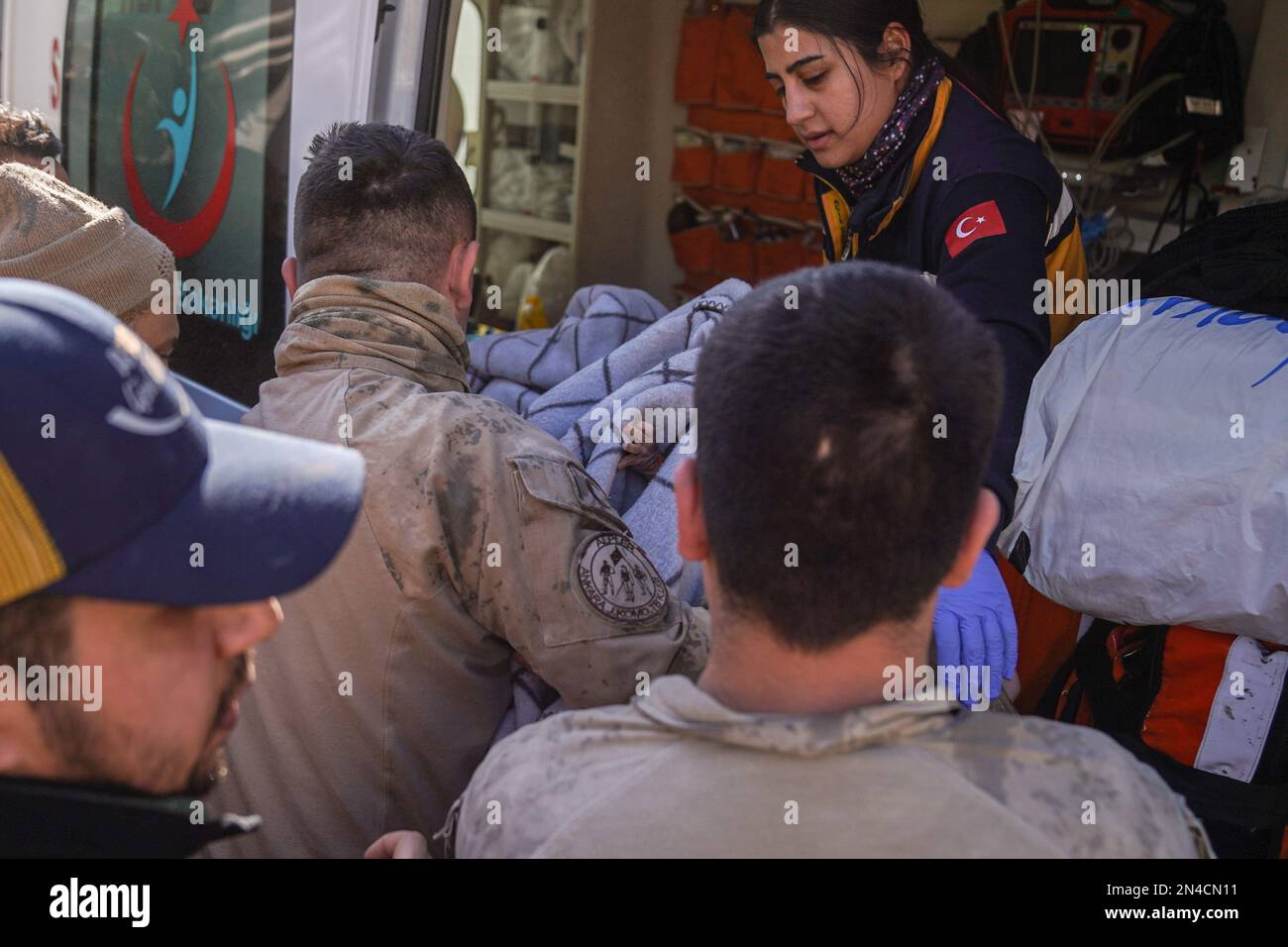 Soldiers carry a 20-day-old baby who was rescued 59 hours after the ...