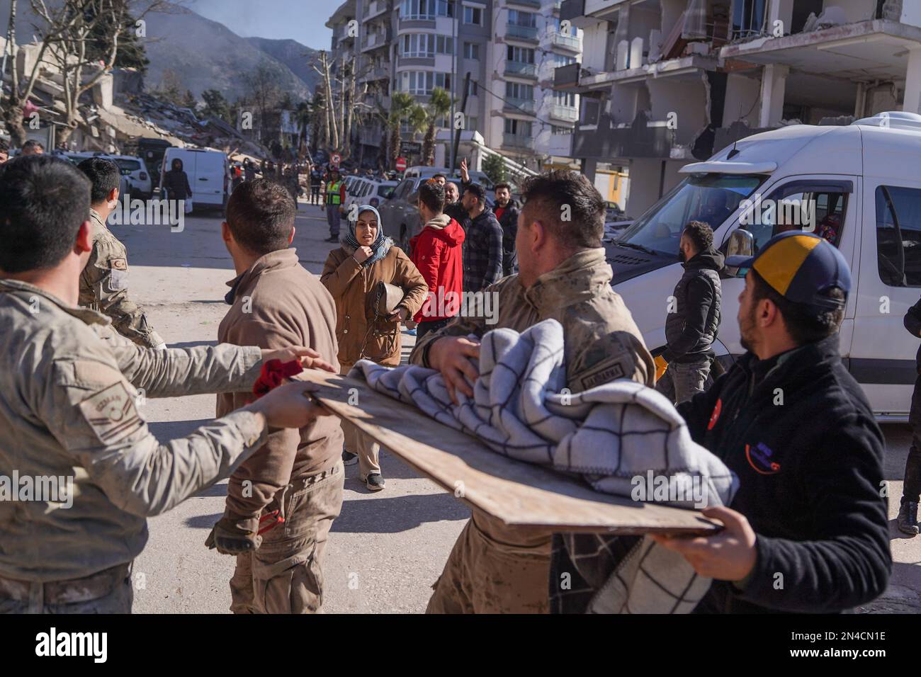 Soldiers carry a 20-day-old baby who was rescued 59 hours after the ...