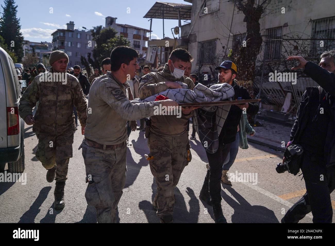 Soldiers carry a 20-day-old baby who was rescued 59 hours after the ...