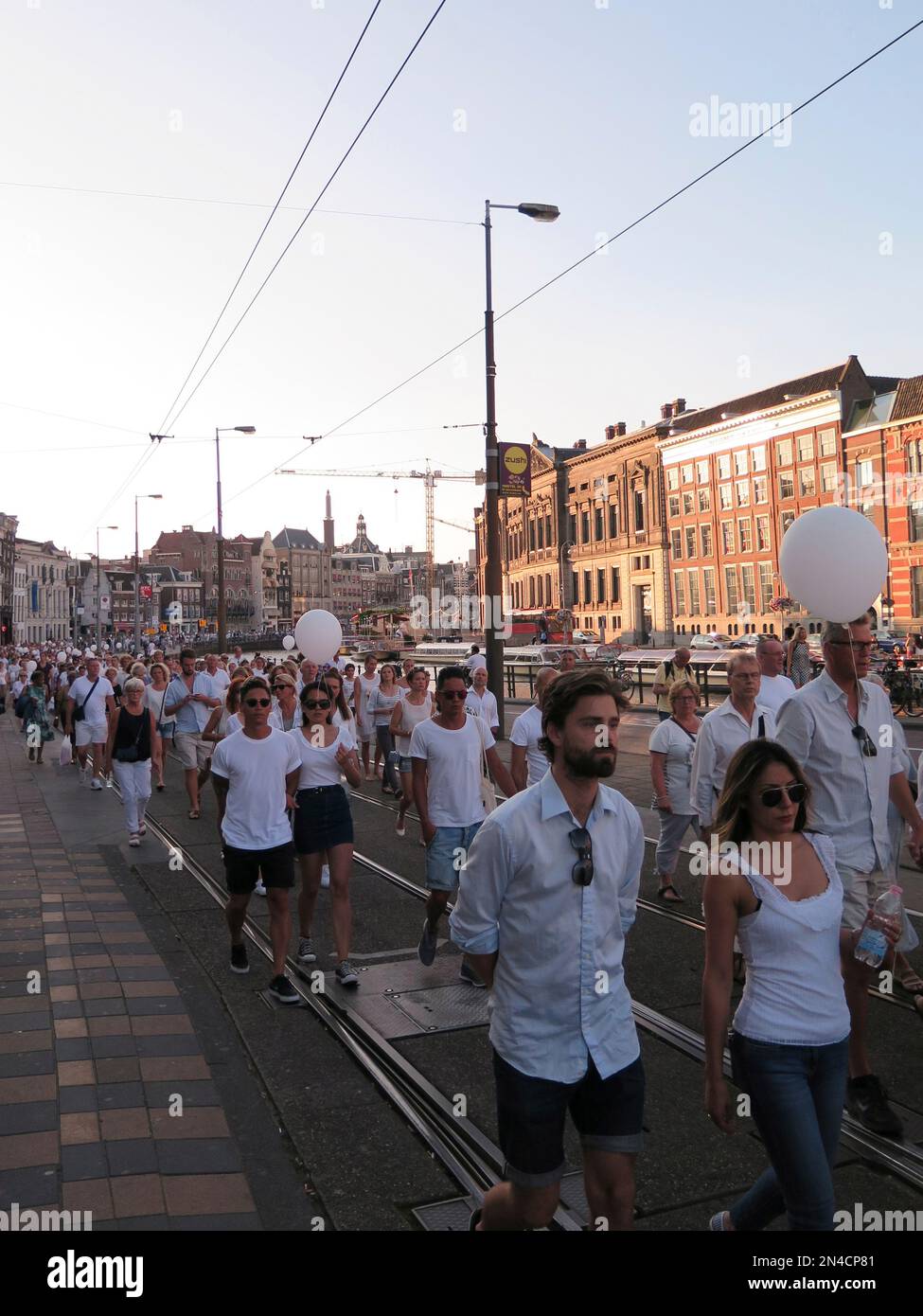 CAPTION CORRECTS PHOTOGRAPHER'S NAME - People attend a silent march of ...
