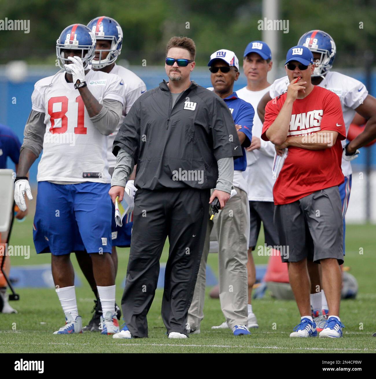New York Giants offensive coordinator Ben McAdoo watches practice ...
