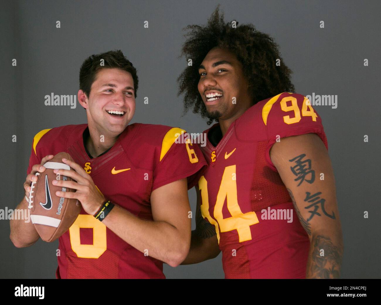 Southern California quarterback Cody Kessler, left, and defensive end ...