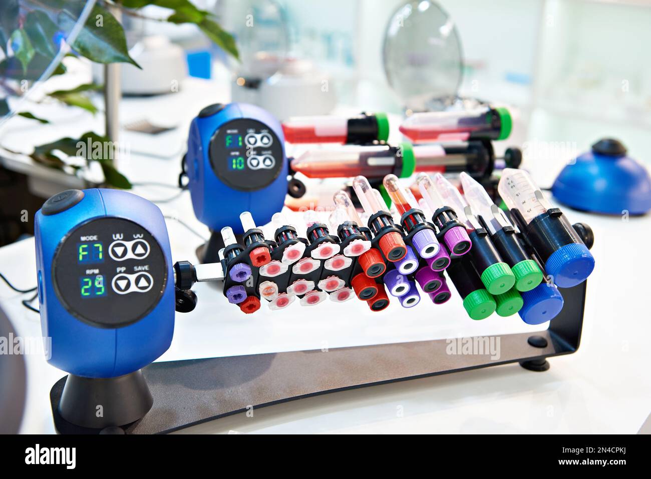 Rotary medical mixer on lab Stock Photo - Alamy