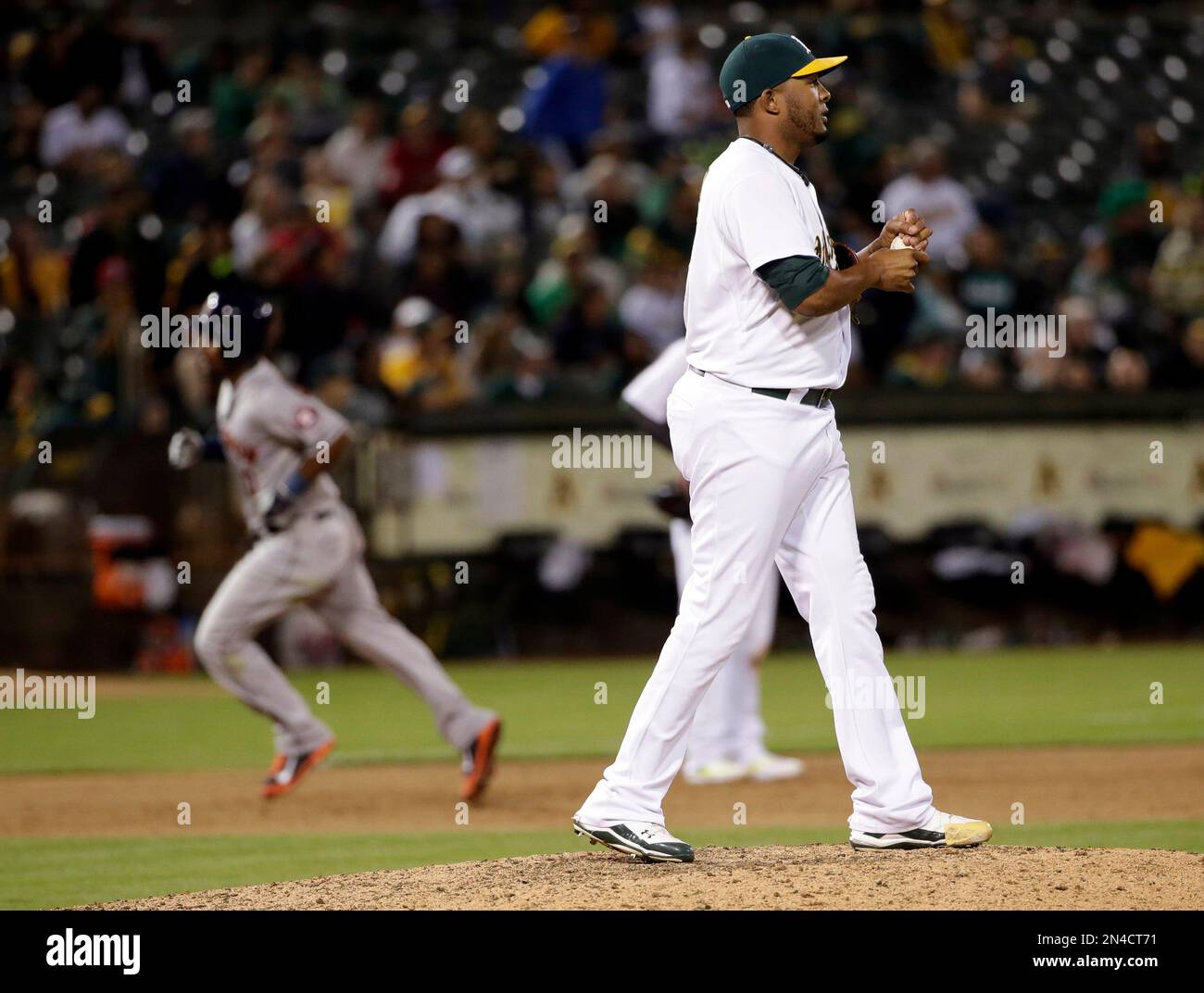 Oakland Athletics relief pitcher Fernando Abad stands on the mound as ...
