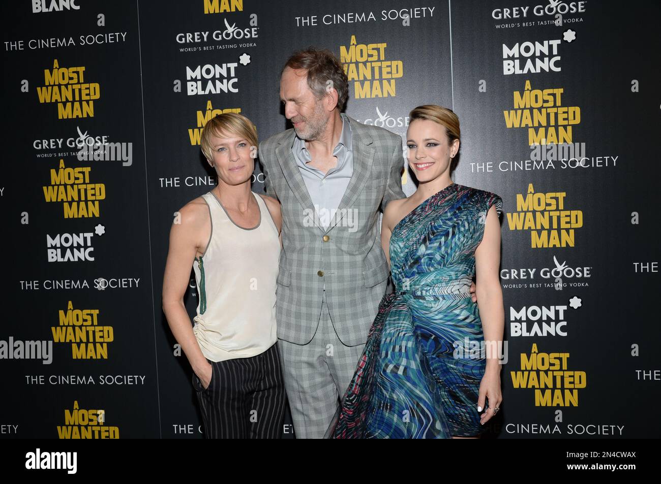 From left, Robin Wright, Anton Corbijn and Rachel McAdams attend the ...