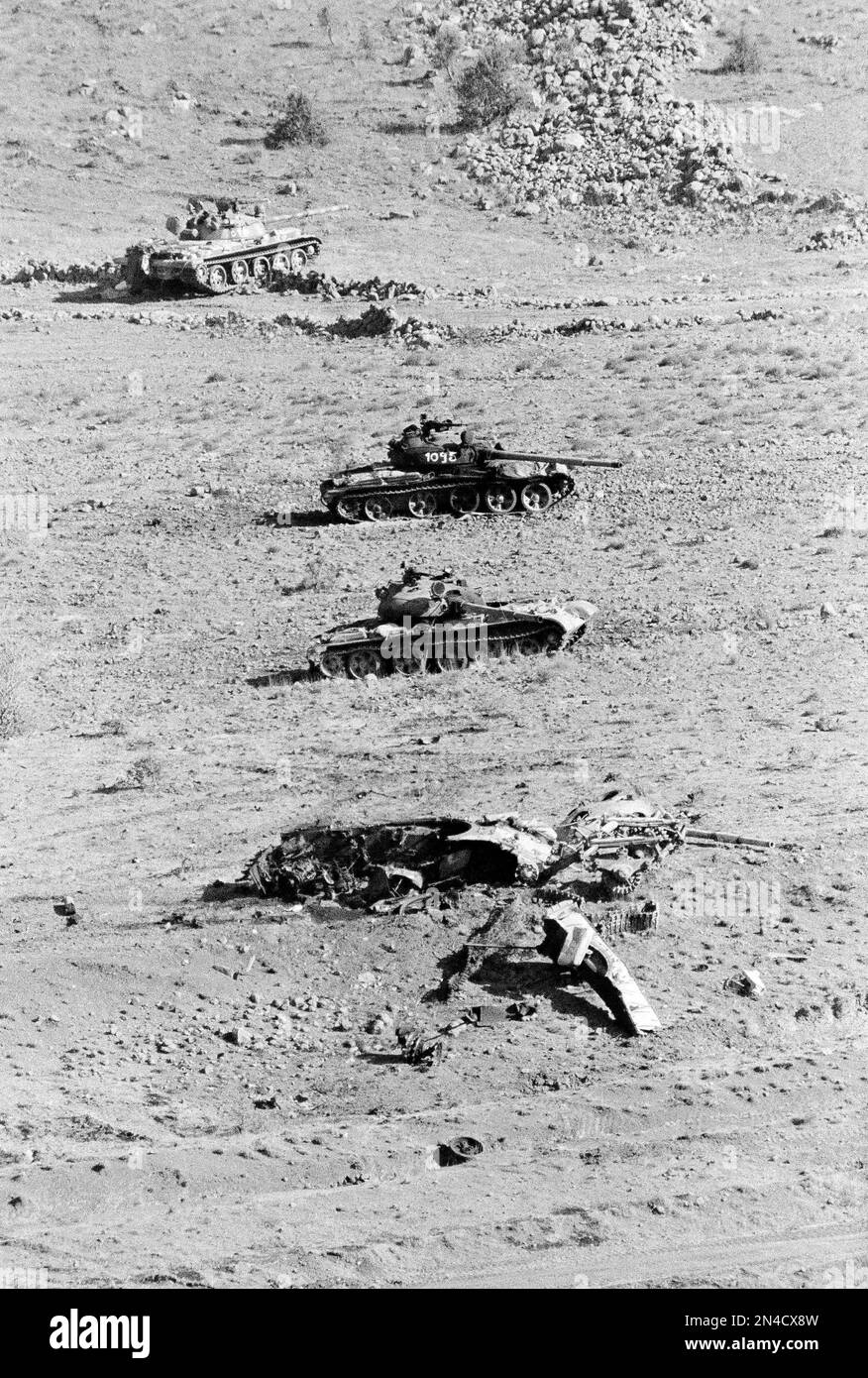 A line of disabled Syrian tanks showing varying degrees of damage stand ...