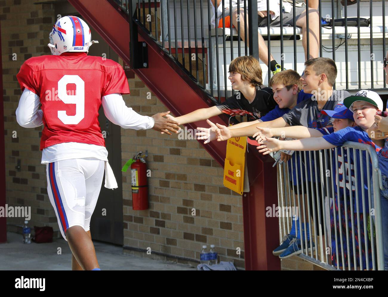 Buffalo Bills quarterback Thad Lewis (9) high fives young fans during ...