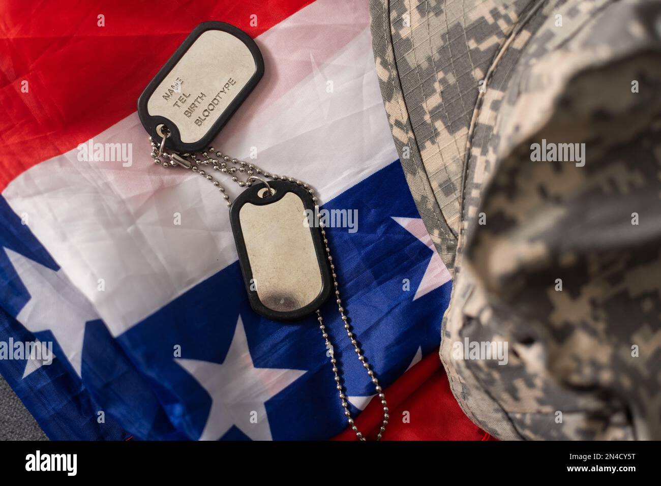 Army tokens on American national flag background Stock Photo - Alamy