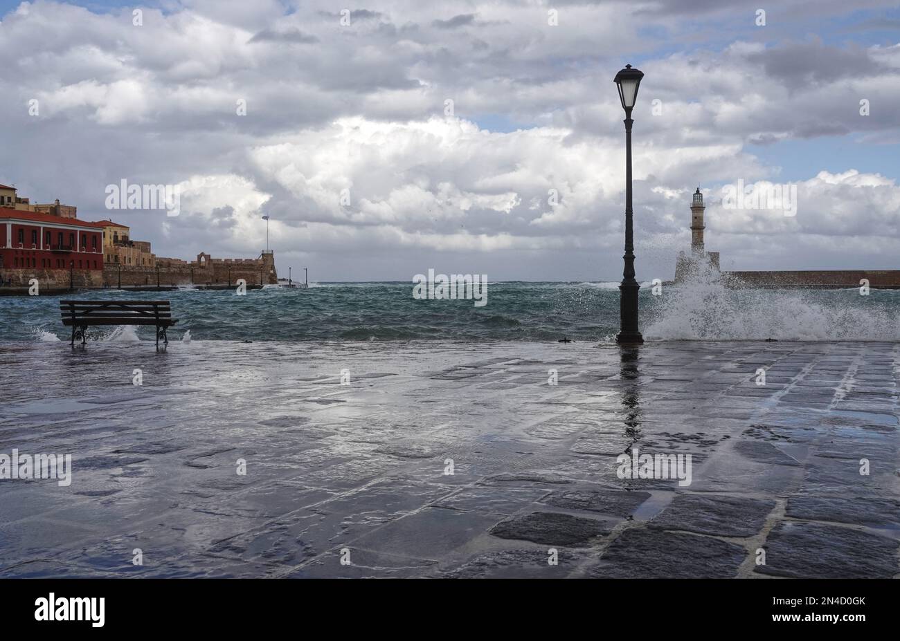 Wet, stormy weather and crashing waves at the quayside in the Venetian ...