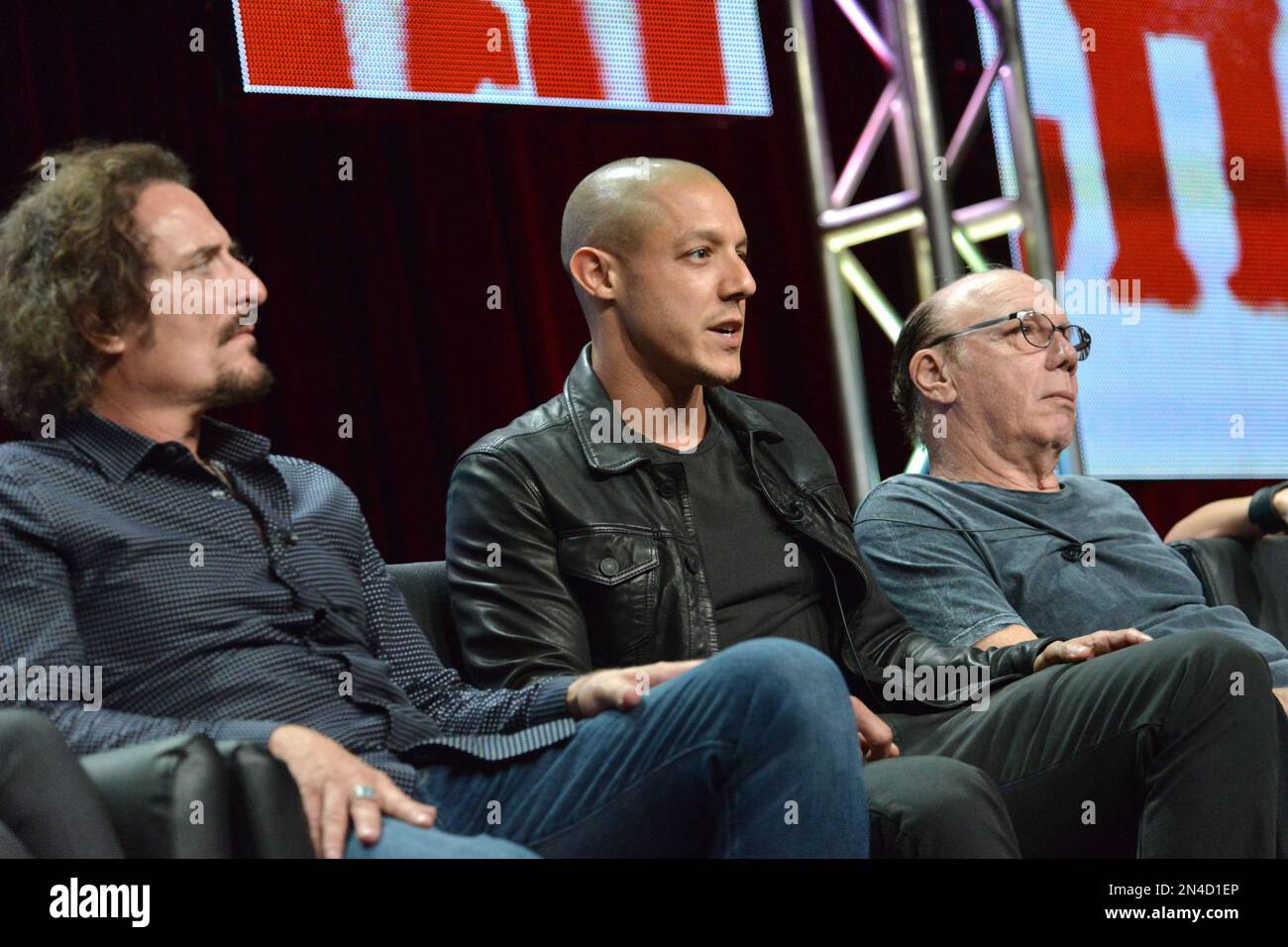 From left, Kim Coates, Theo Rossi and Dayton Callie speak on stage ...