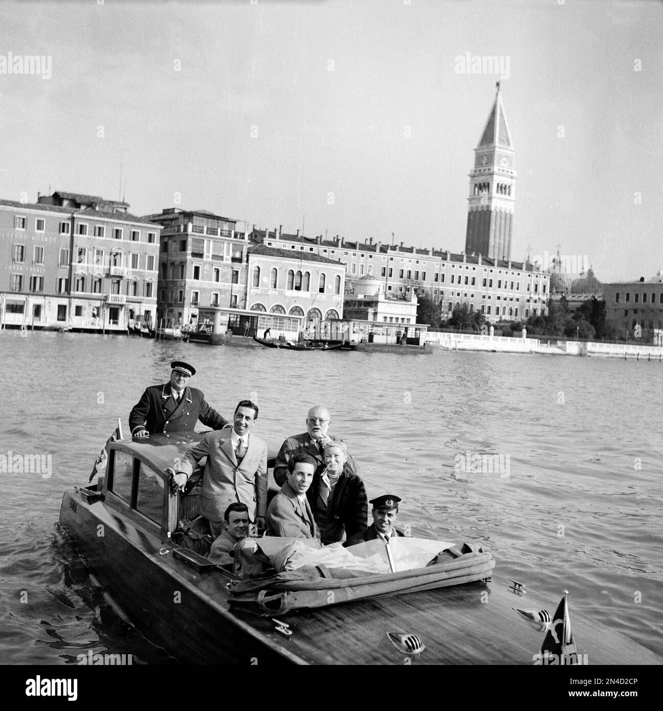 U.S. novelist Ernest Hemingway (standing) and his wife Mary have a ride ...