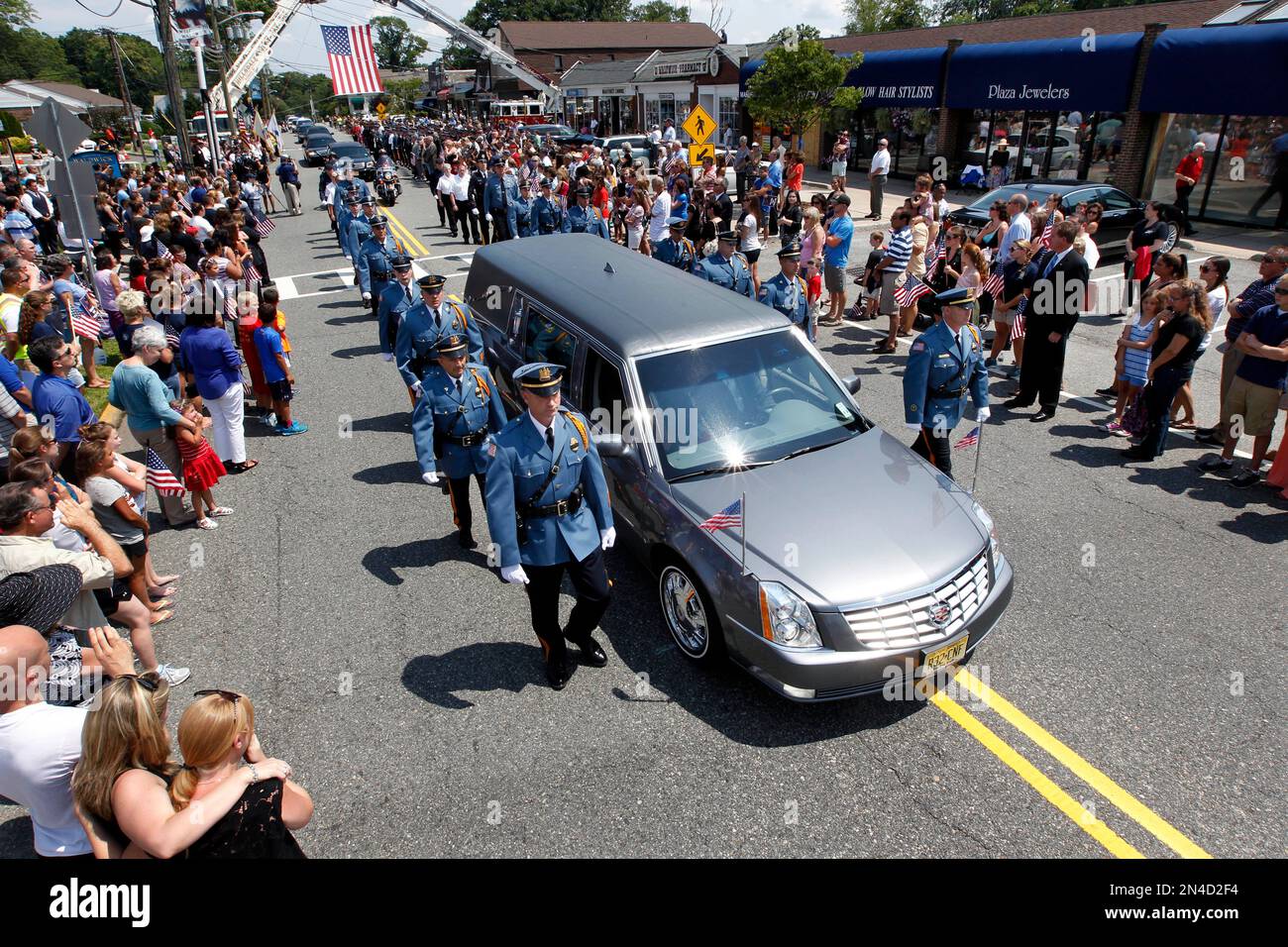 Police officers escort the hearse bearing Waldwick, N.J., Police ...