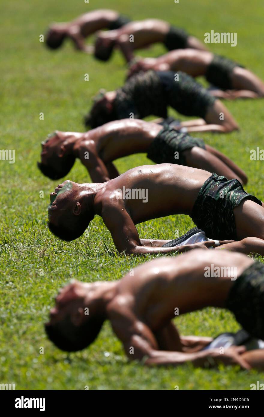Taiwan Marine Corps "Frog Men" display stretching routines during a ...