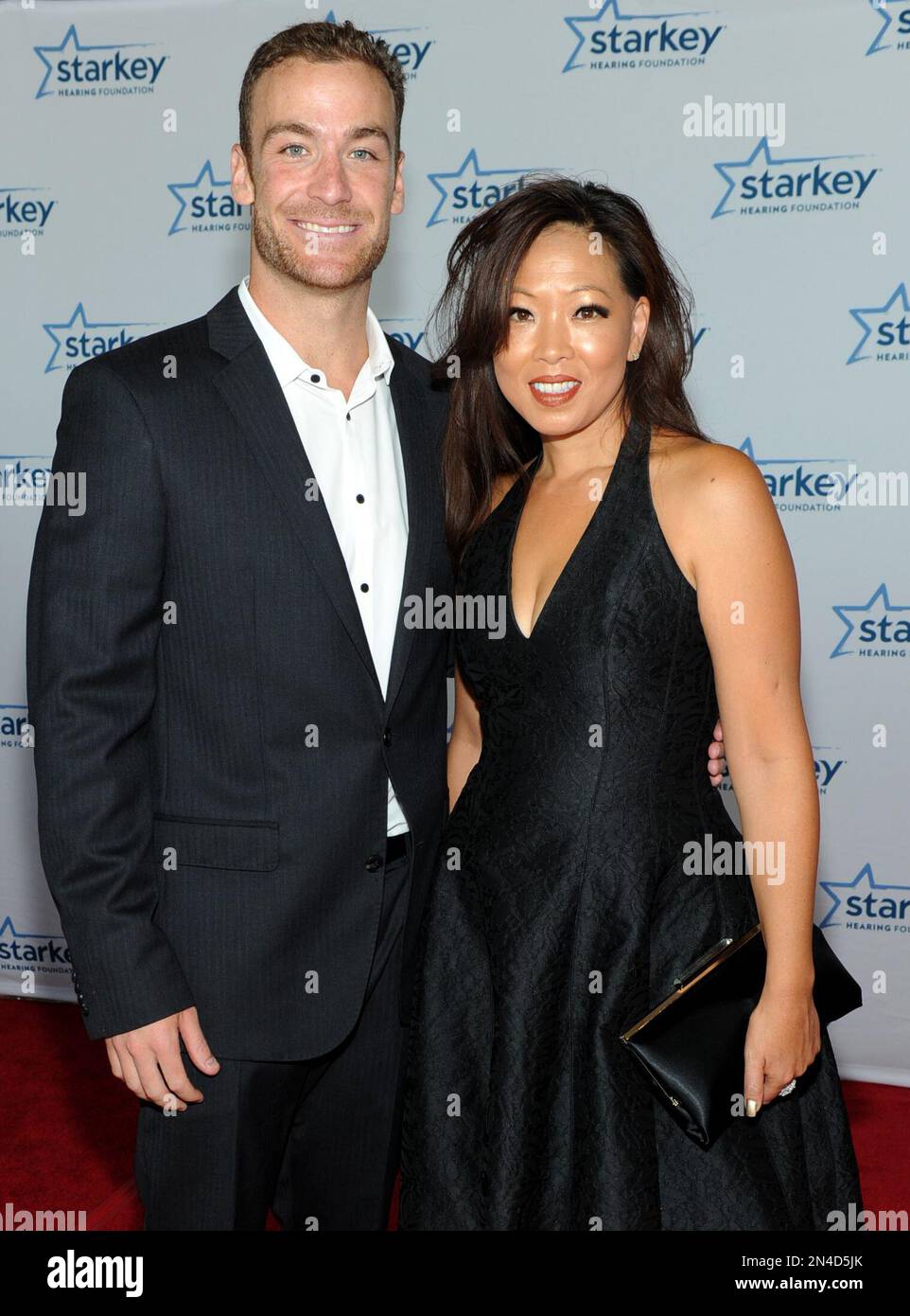 Olympian Ed Moses and poker player Michelle Lau are seen on the red ...
