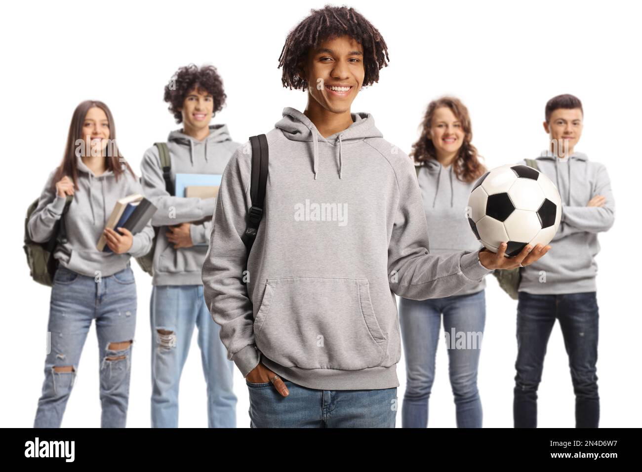 Group of teenage students with a football isolated on white background ...