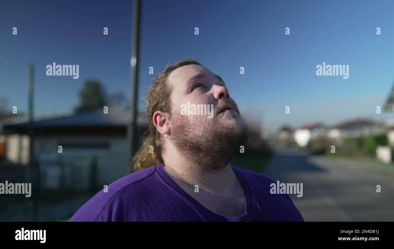 One hopeful overweight man standing hi-res stock photography and images ...