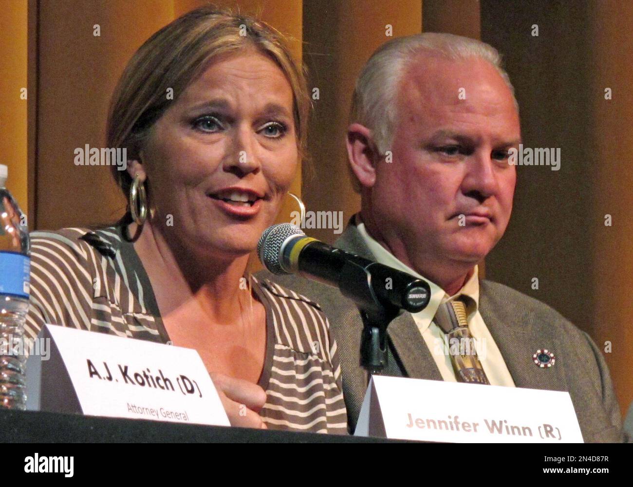 In this July 16, 2014 photo Jennifer Winn, left, a Wichita business ...