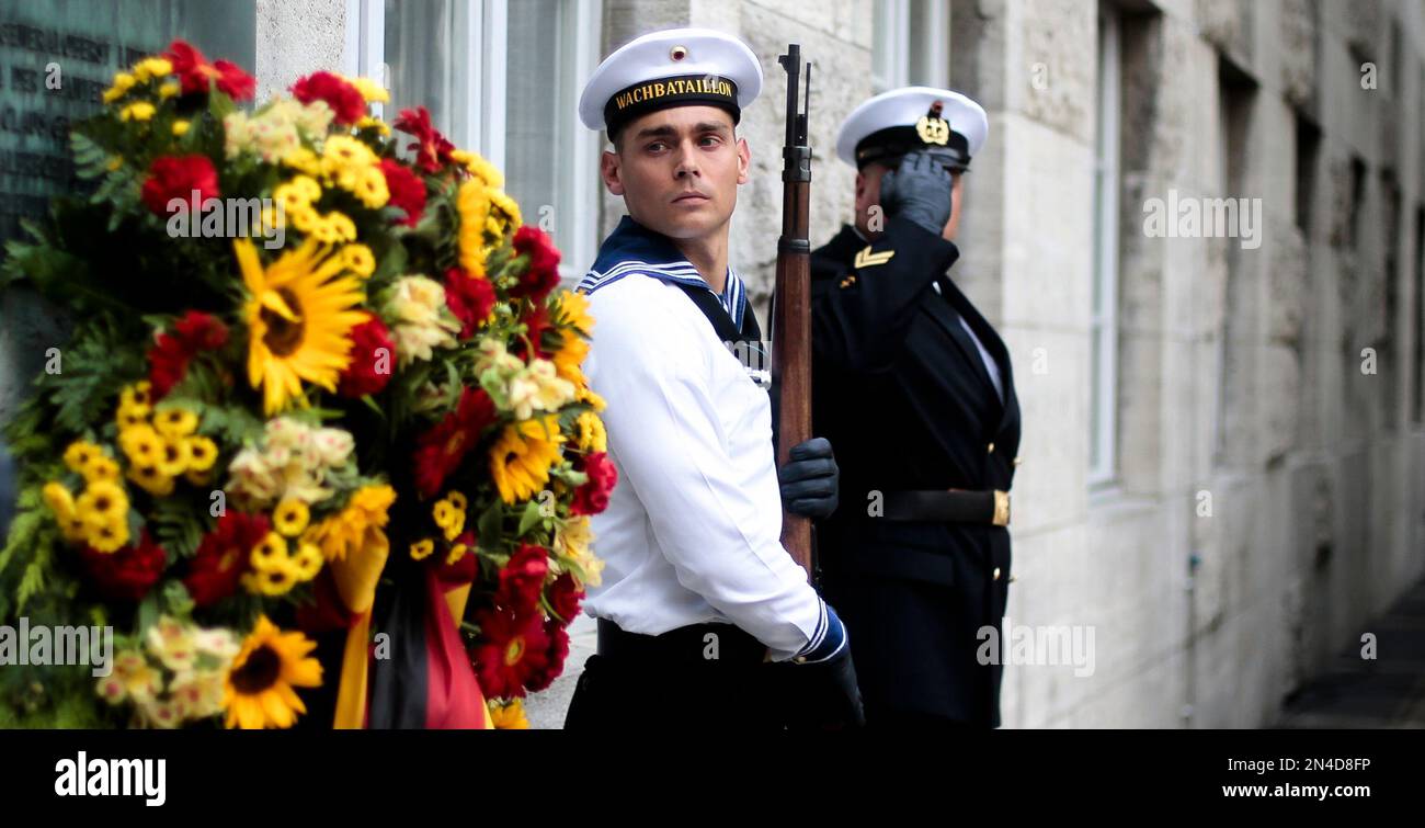 German honor guards attend a wreath laying ceremony to commemorate the ...