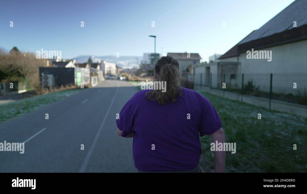 Exercise and healthy concept. A Fat man running in street. Tracking ...