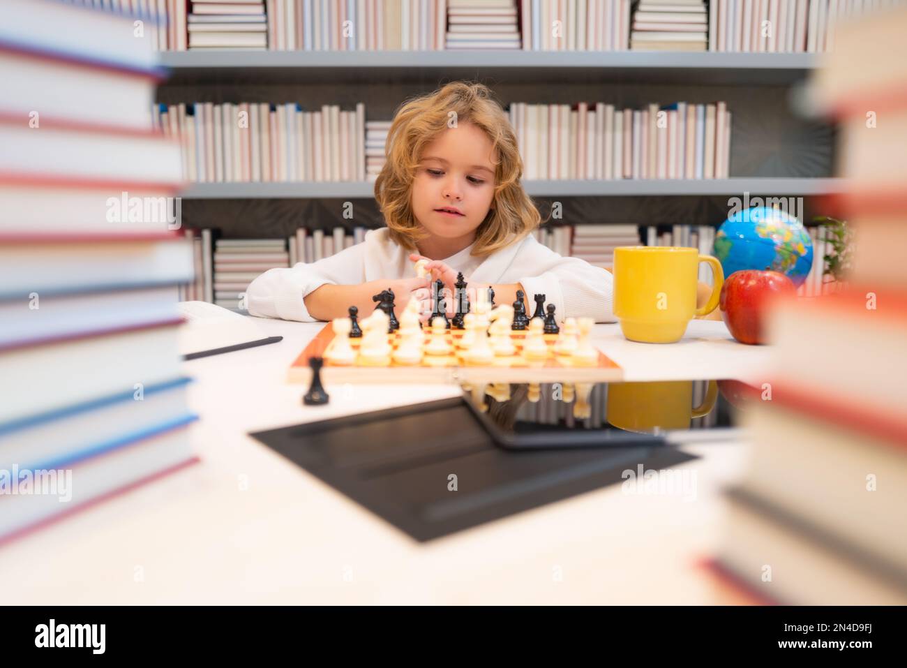 Schoolboy chessman thinker. Chess school. Child think or plan about ...