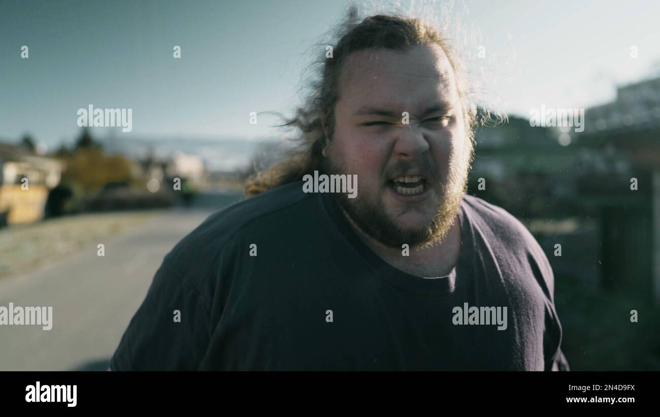 Angry. man walking outside feeling upset. Portrait face of an ...